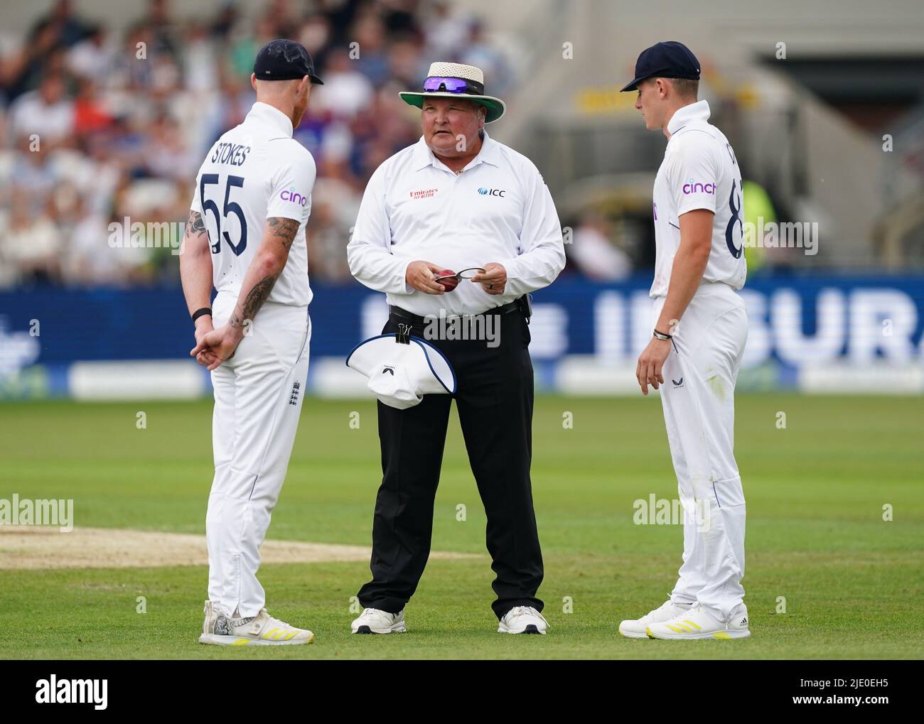 England's Ben Stokes (left) and Matthew Potts (right) speak to umpire ...