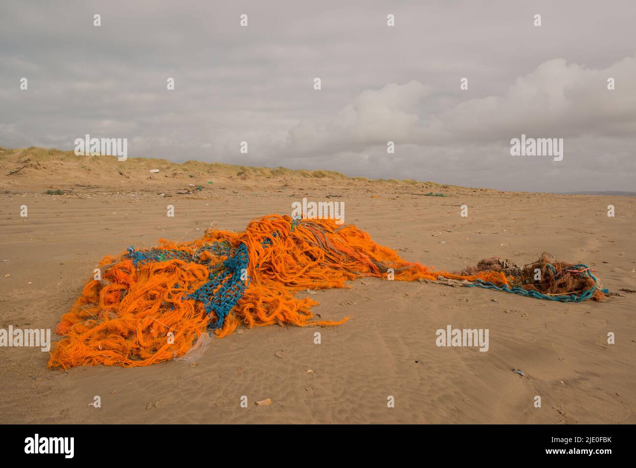 Washed up cod end of trawl net on Pembrey beach, Wales, UK Stock Photo ...