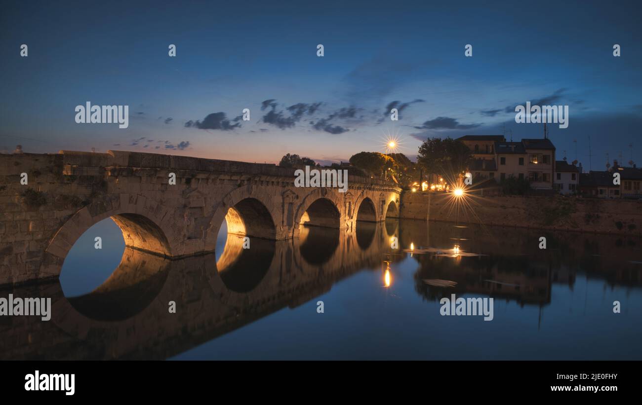 The Roman bridge of Augustus and Tiberius in Rimini at night Stock ...