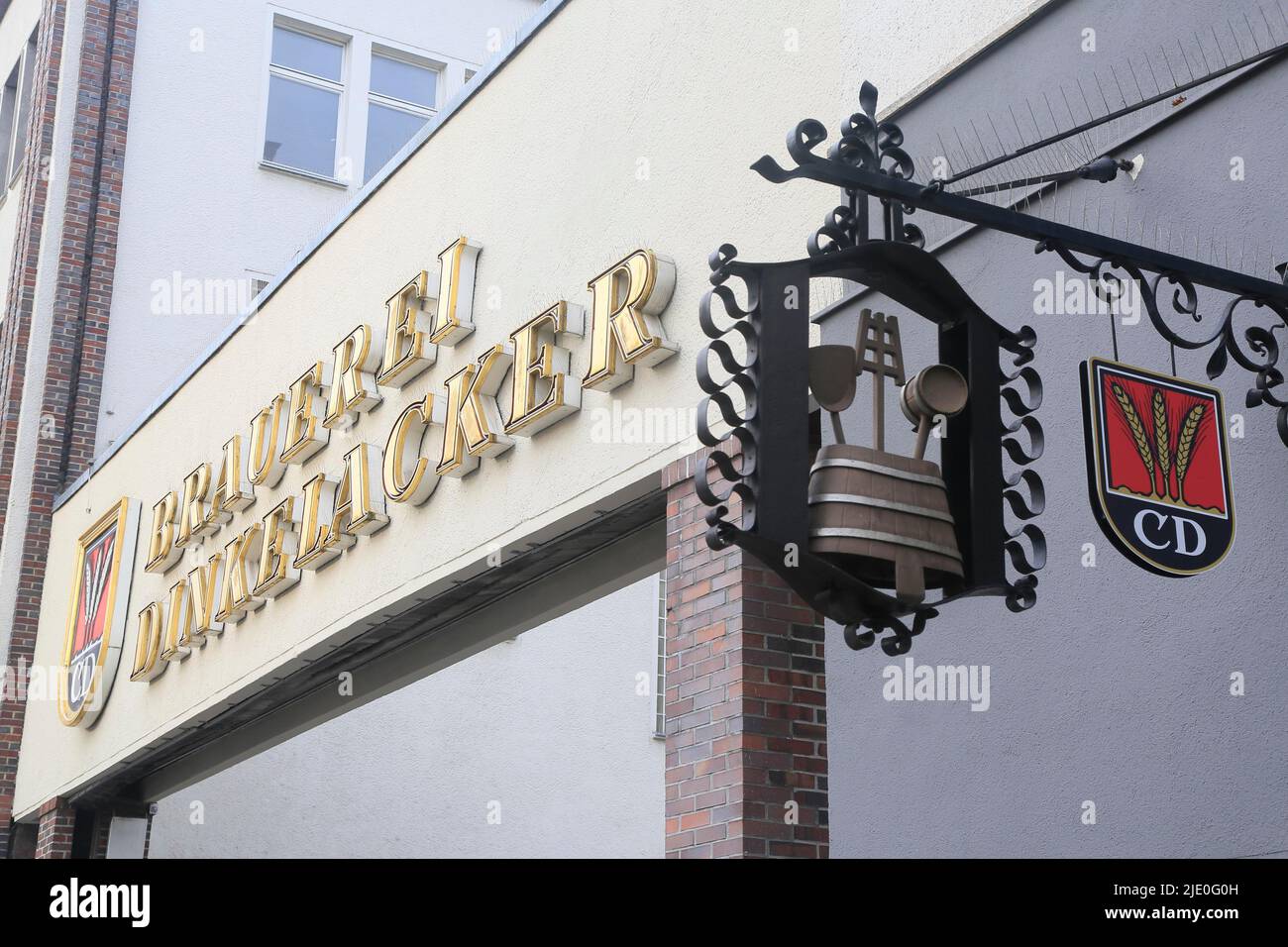 Lettering and pub sign of the Dinkelacker brewery at the entrance to ...