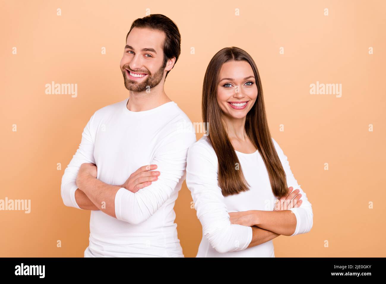 Photo of pretty young brown hairdo couple crossed palms wear white ...
