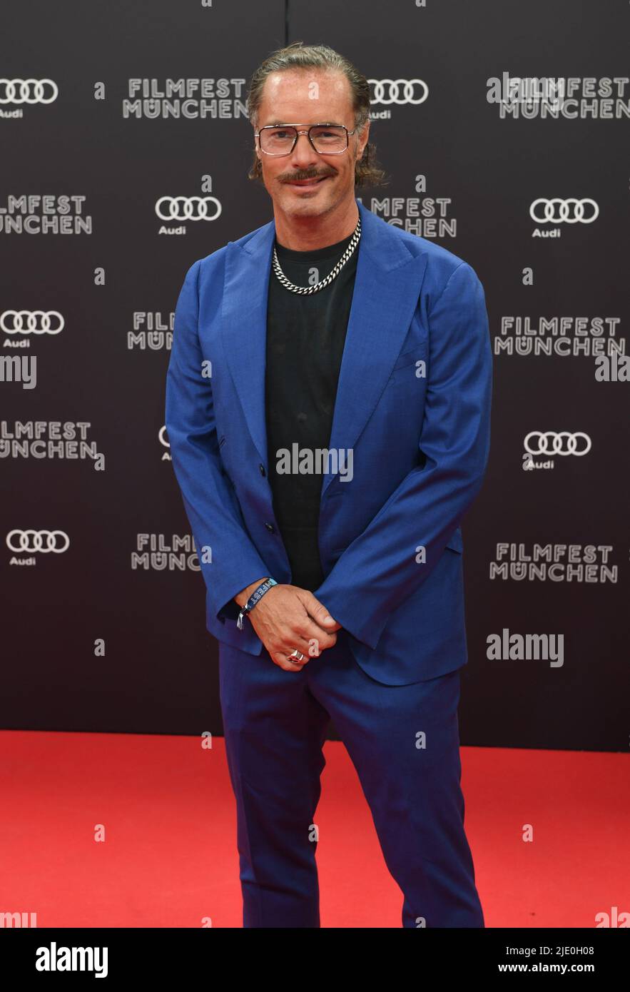 Munich, Germany. 23rd June, 2022. Actor John Friedmann shows up on the Red Carpet at the Film ...