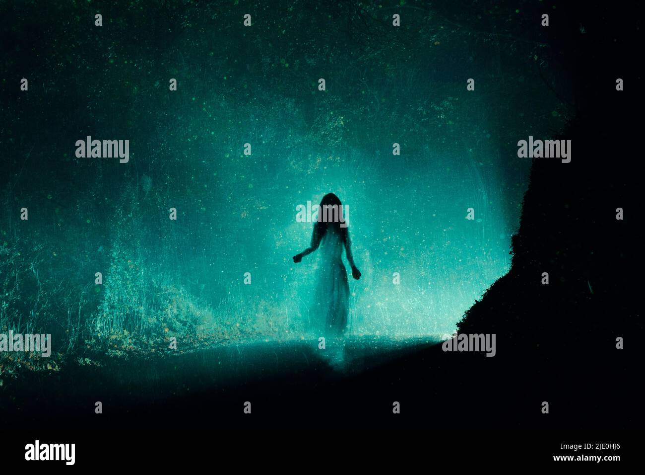 A supernatural concept of a spooky ghost woman, haunting a country road ...