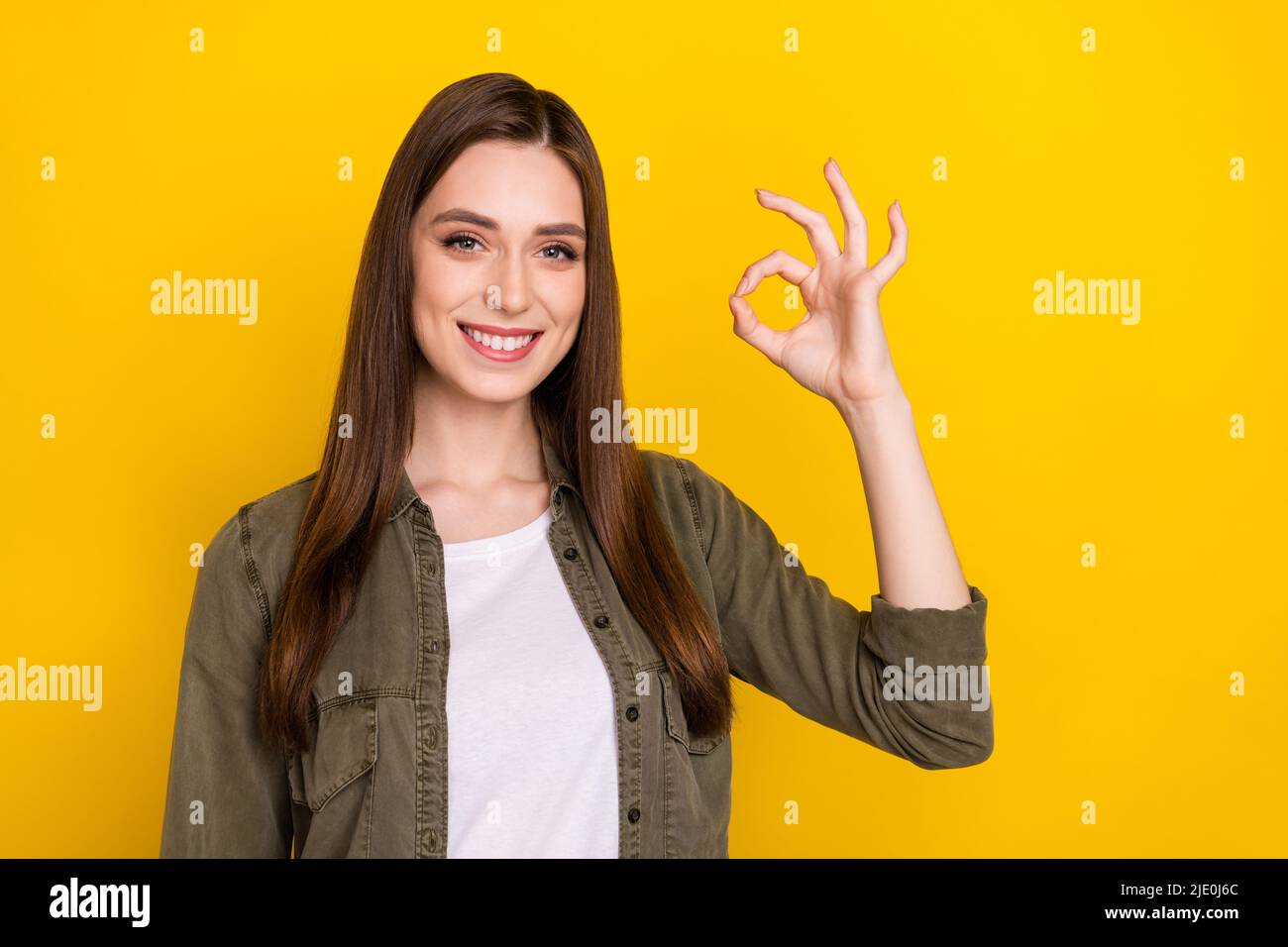 Photo of adorable sweet female showing okay gesture promoting sale ...