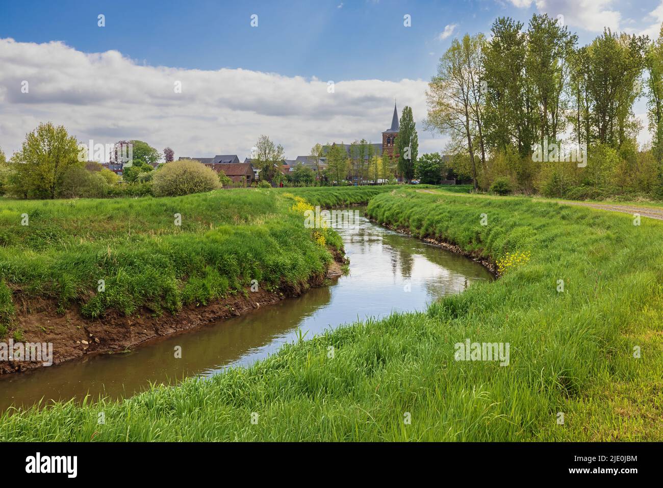 The Demer river meandering through the landscape with Zichem in the ...