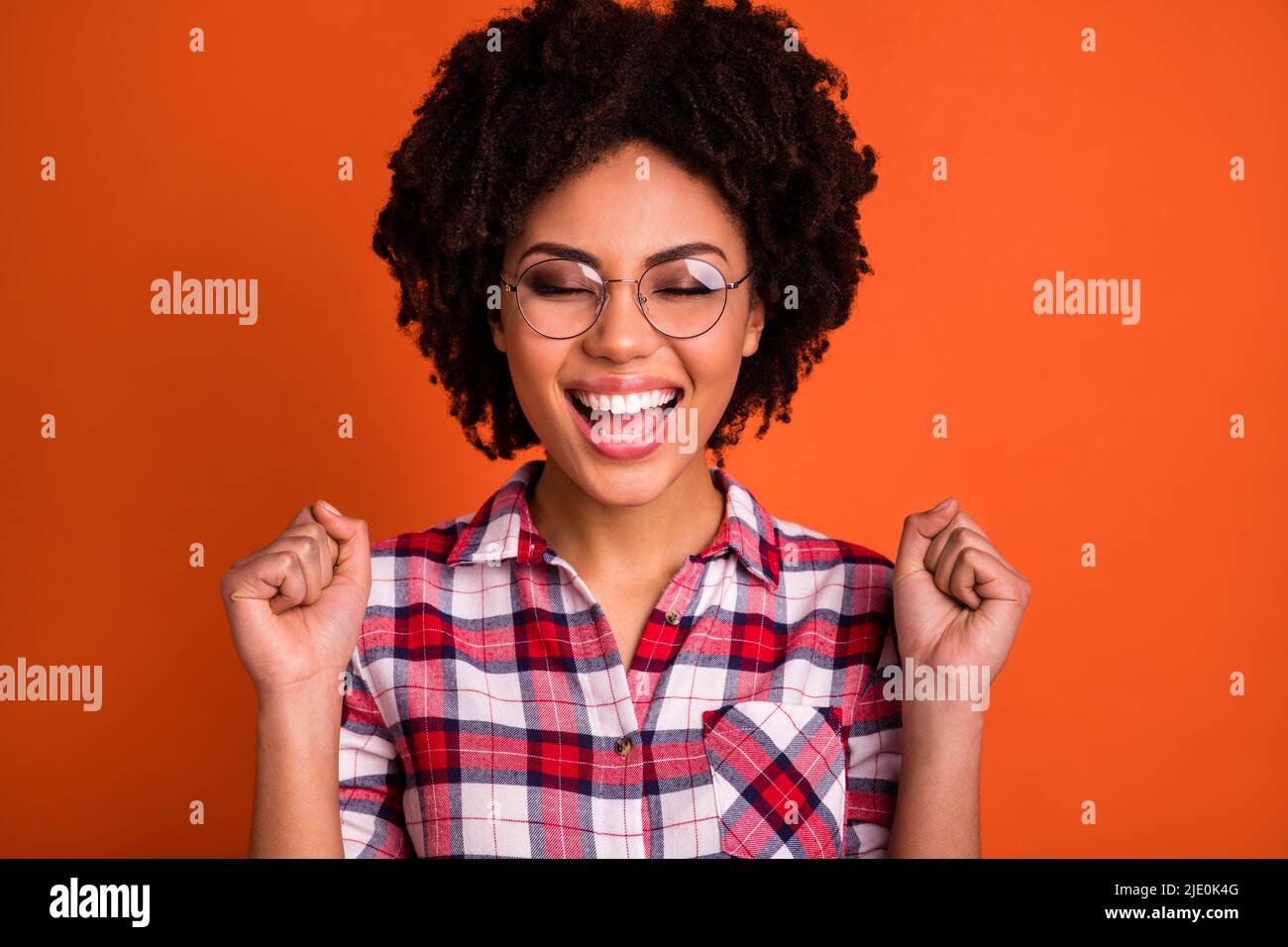 Portrait of cheerful lady fist up celebrate lucky lottery win wear ...