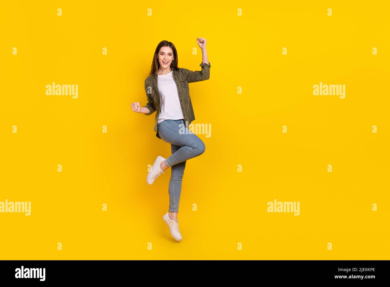 Full length photo of overjoyed good mood girl jumping up in excitement ...