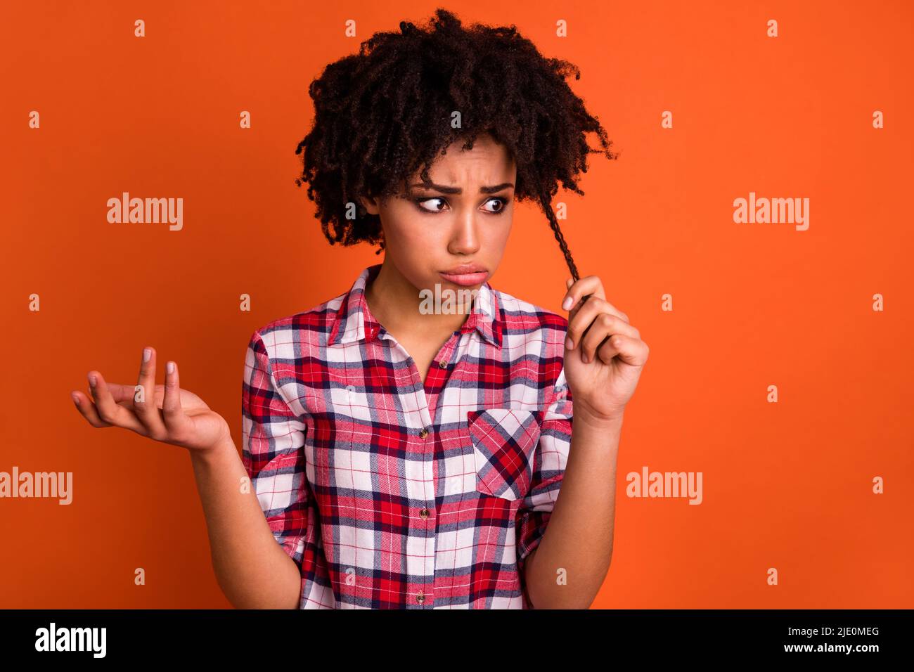 Portrait of unsatisfied gloomy girl hand touch hold hairdo curl ...