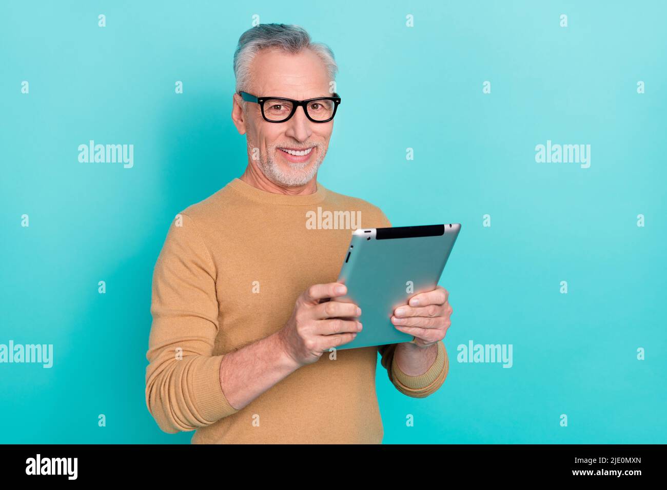 Photo of positive intelligent person hold tablet toothy smile look ...