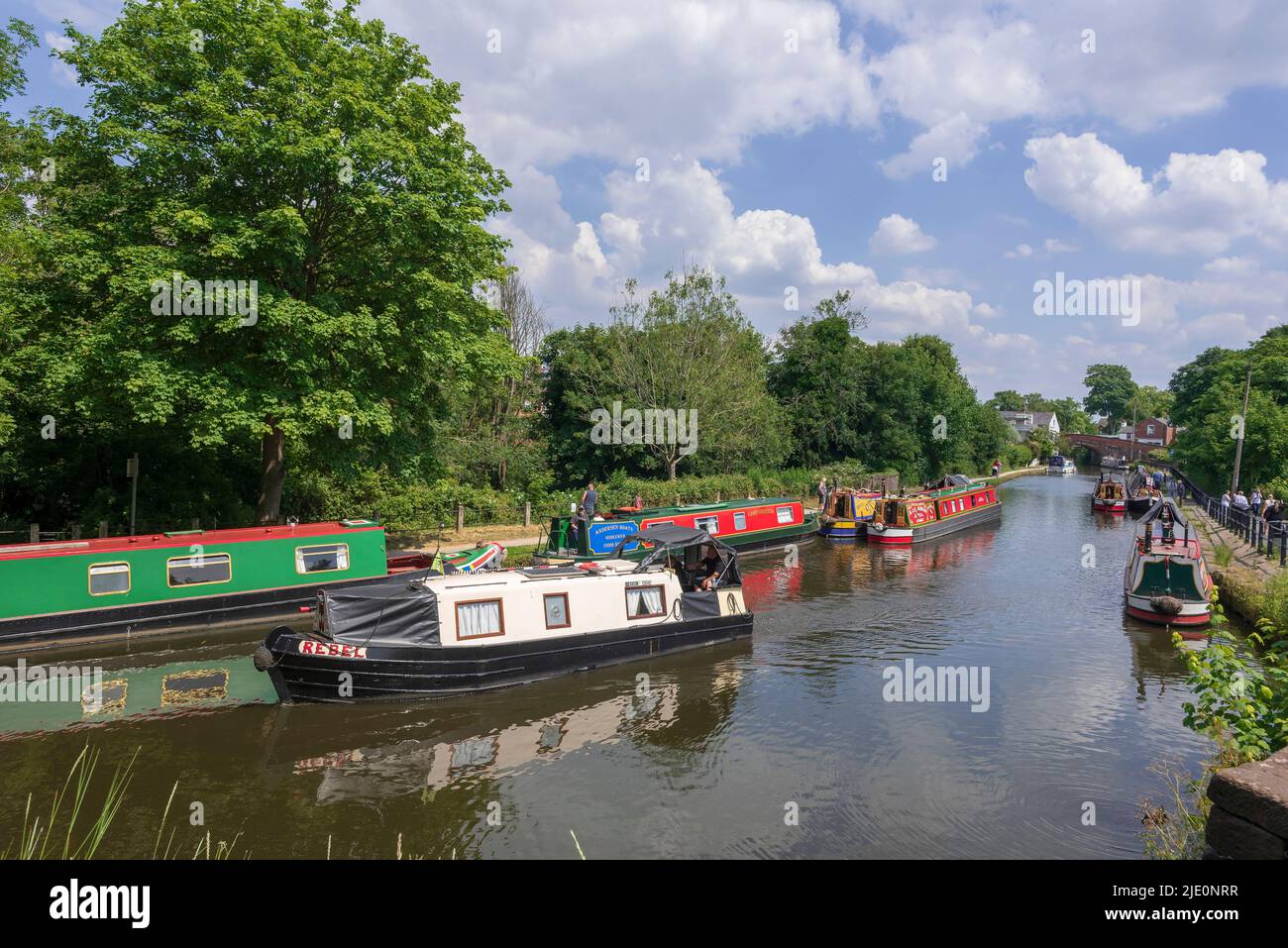 Brightly decorated canal narrowboats on the Bridgewater canal at Lymm ...