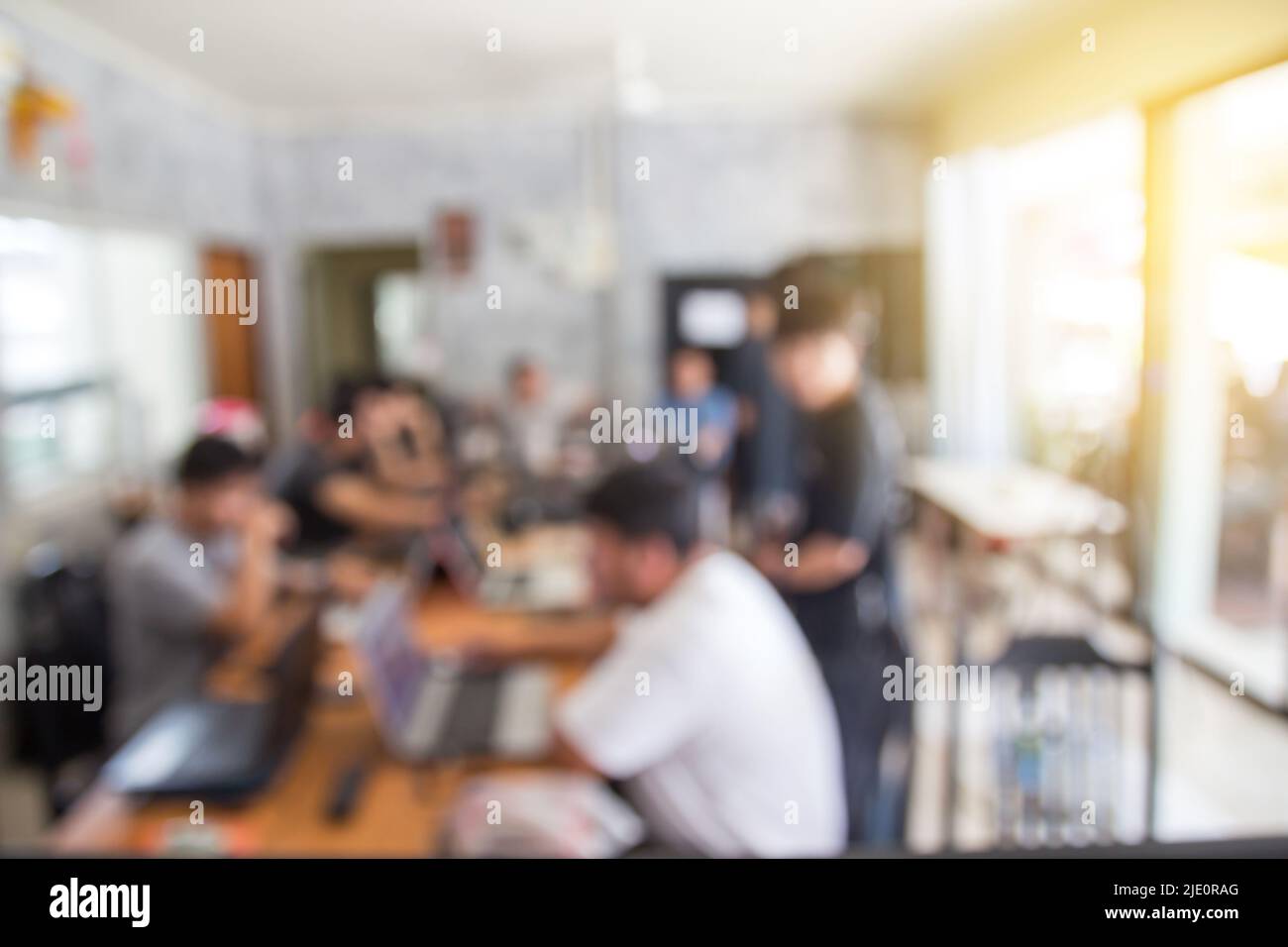 Blur abstract background of employees young colleagues sitting at the ...