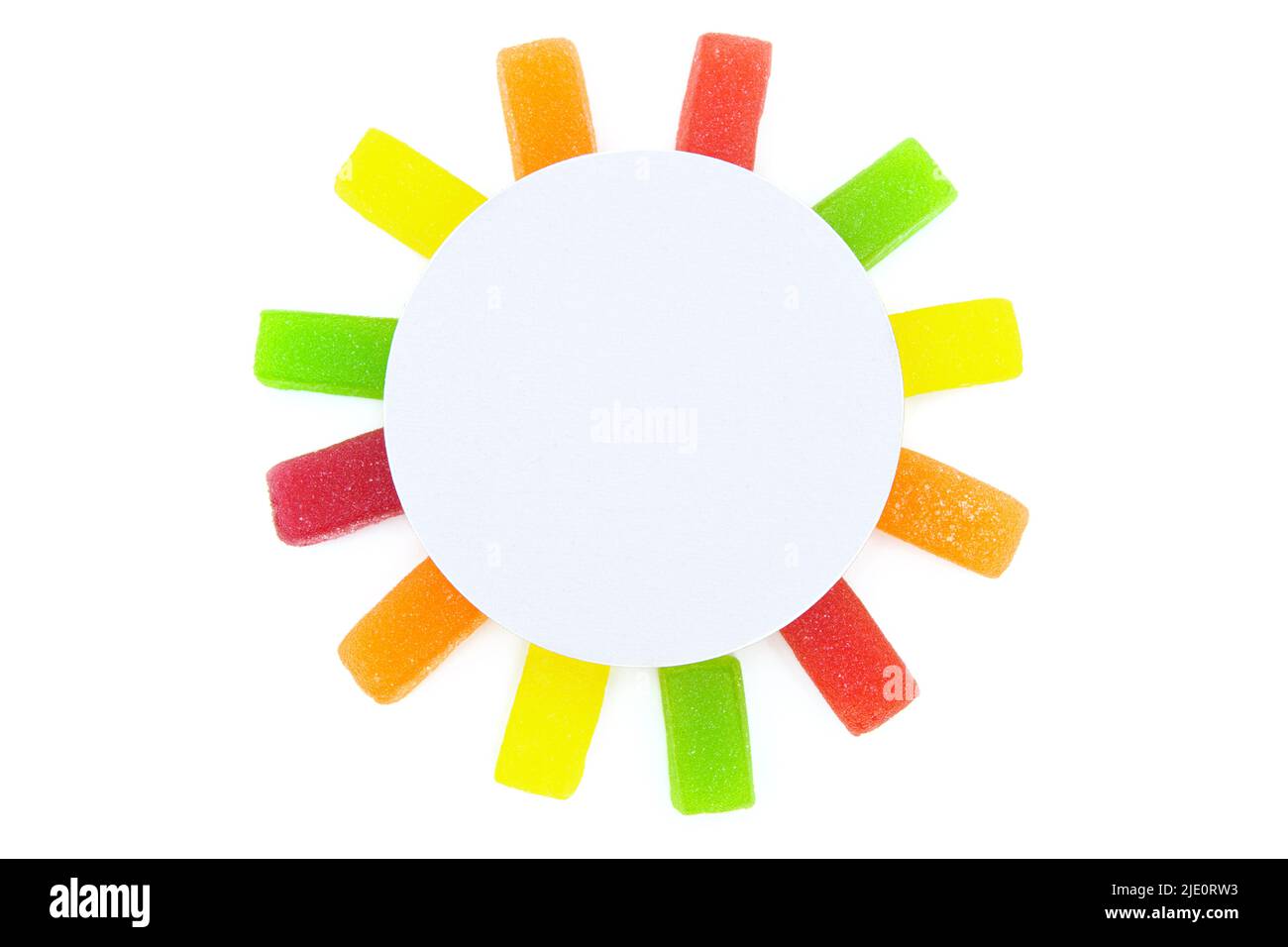 Jelly candies arranged into a sun shape isolated on white. Vivid summer ...