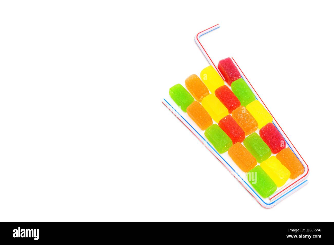 Sweet jelly cubes arranged into a cocktail shape isolated on white ...