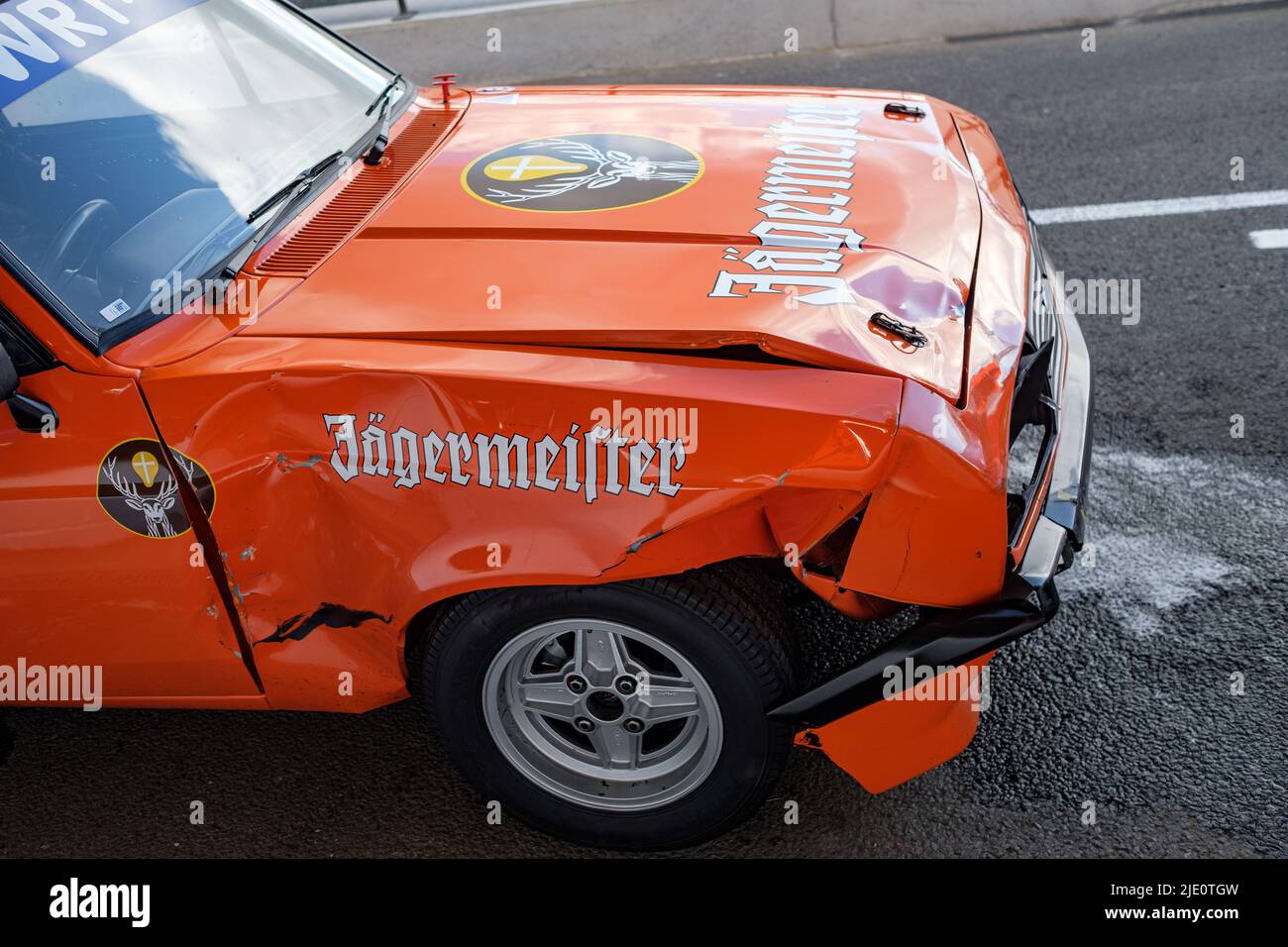 Crash damaged Ford Escort Mk2 RS2000 race car in the pit lane at the ...