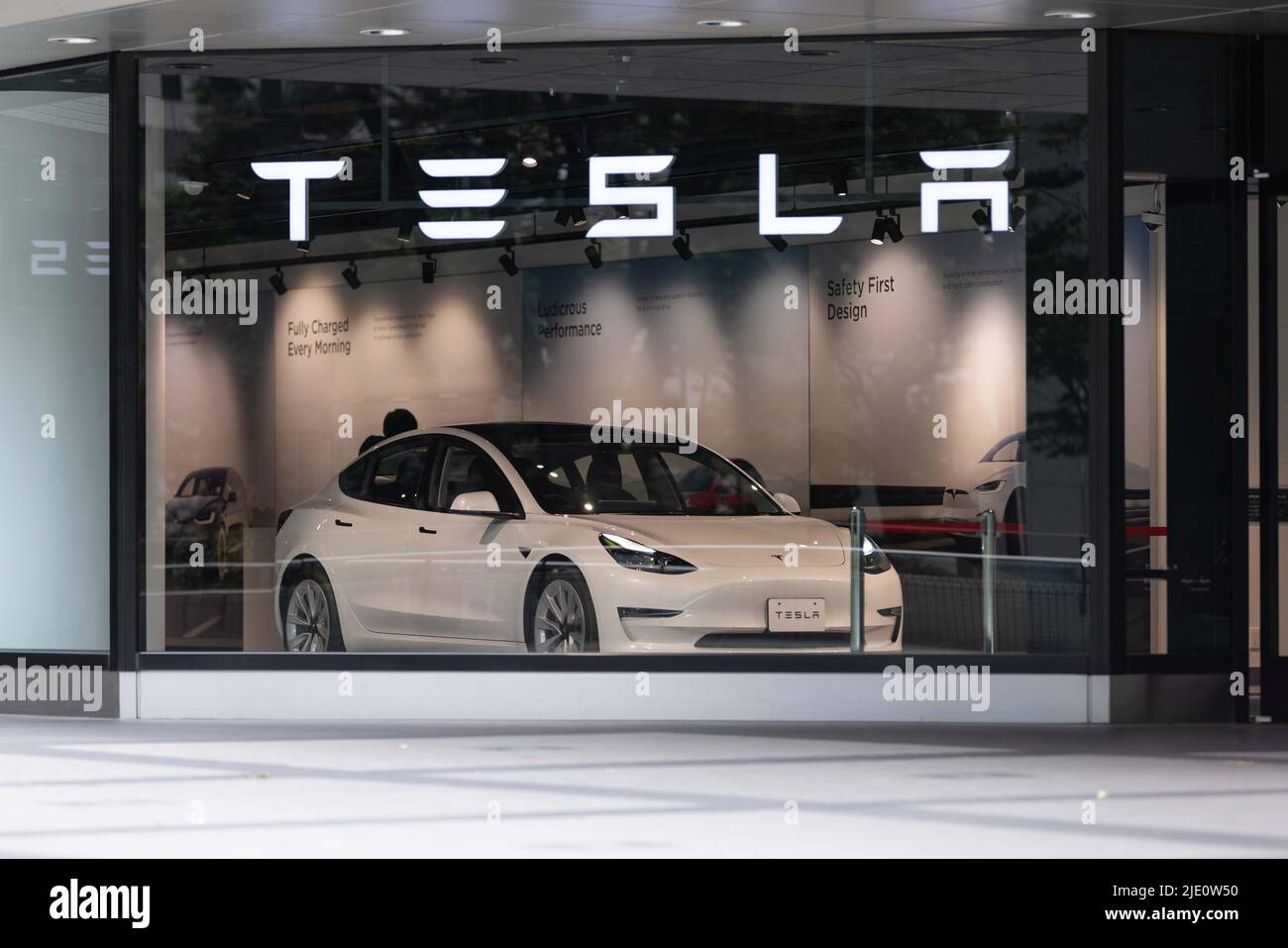 Front window of the Tesla Store in Shinjuku. Tesla has sold more than 5 ...
