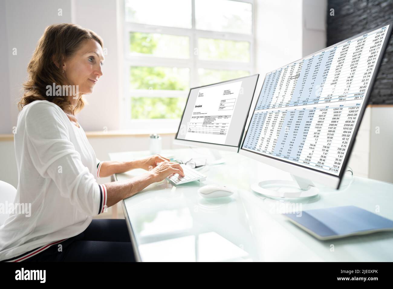 Accountant Using E Invoice Software At Computer In Office Stock Photo ...