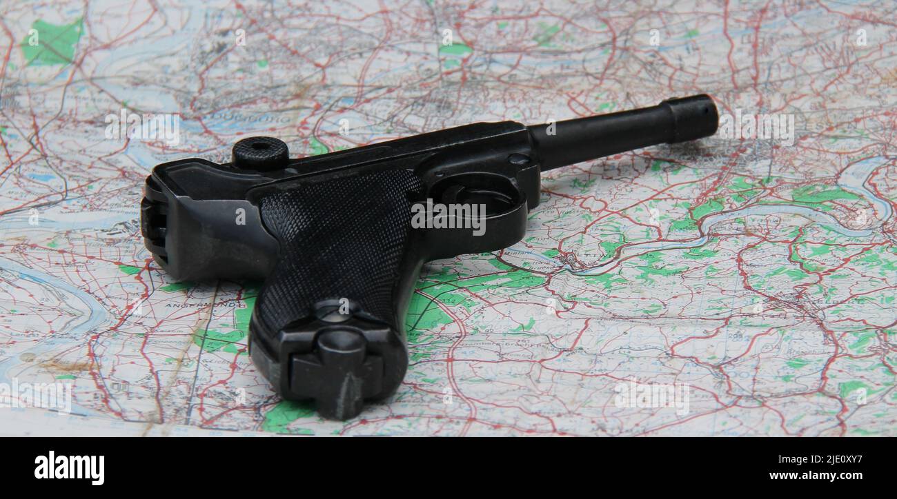 A Vintage Wartime Hand Gun on a Detailed Location Map Stock Photo - Alamy