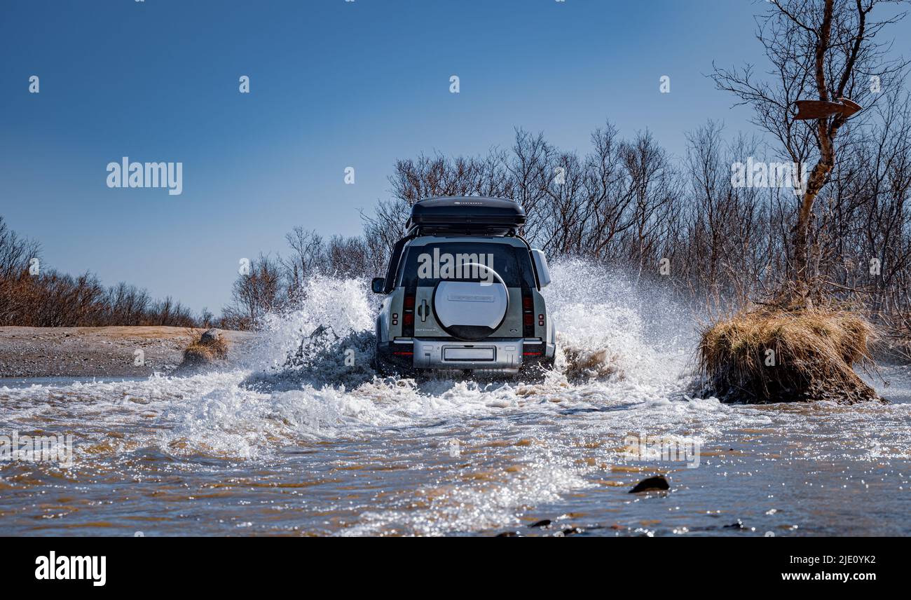 Rybachy, RUSSIA - May 30 2022: Off-roading New Land Rover Defender. The ...