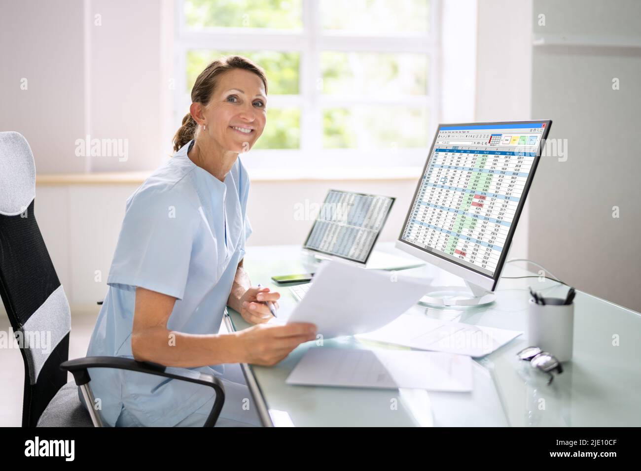 Medical Bill Codes And Spreadsheet Data Business Analyst Woman Stock medical-bill-codes-and-spreadsheet-data-business-analyst-woman-stock