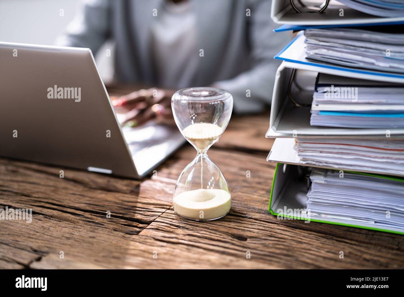 Black Accountant Woman Working With Invoice And Hourglass Stock Photo ...