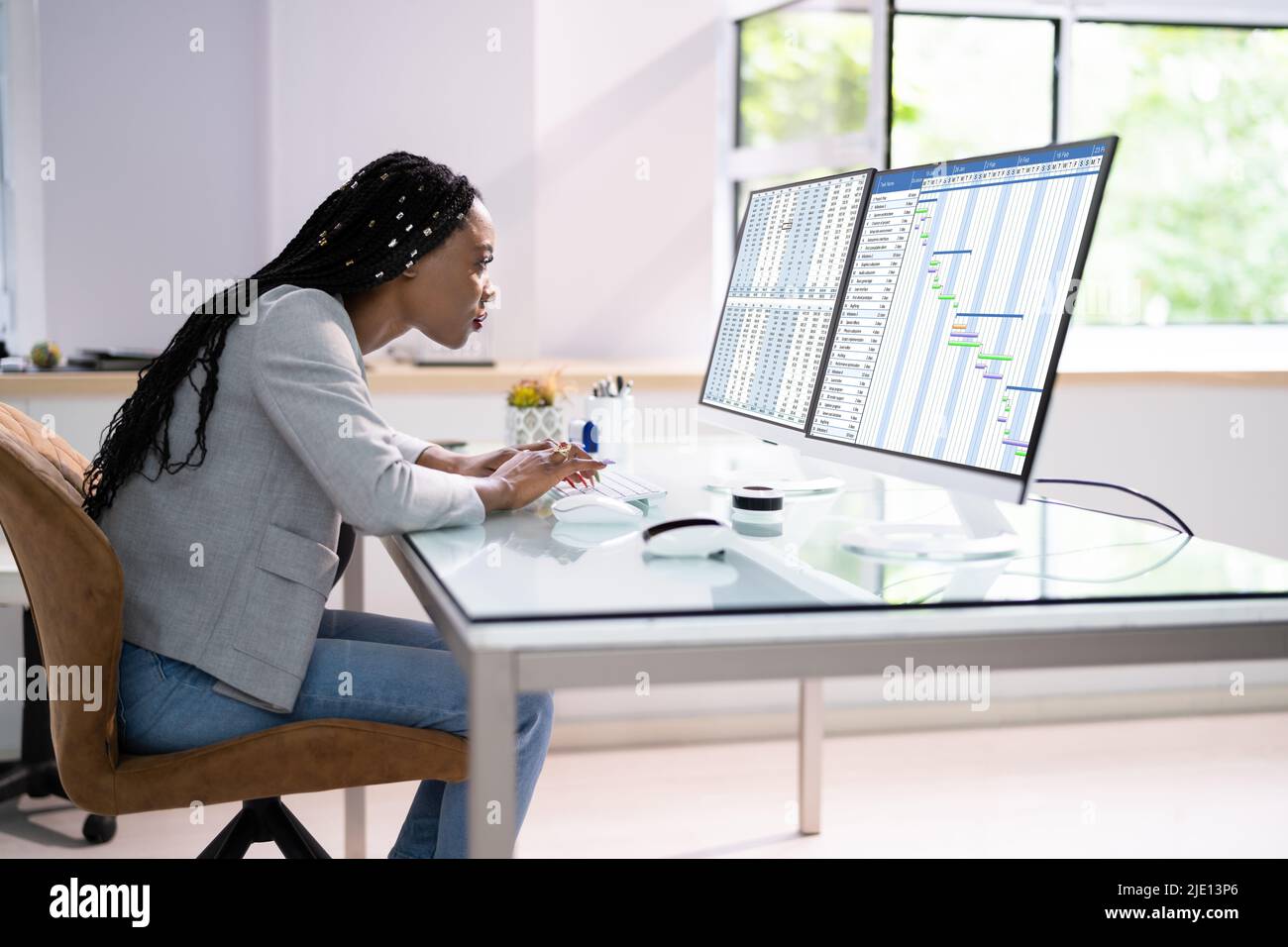 Businesswoman Sitting In Wrong Posture Working On Computer In Office ...