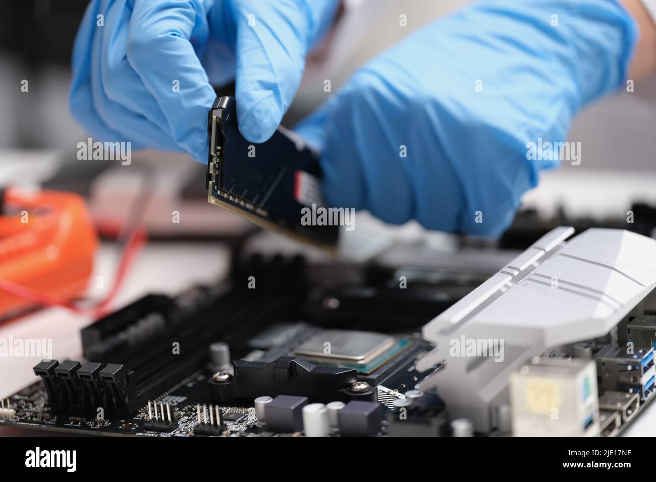 Technician connects CPU microprocessor to motherboard socket Stock ...