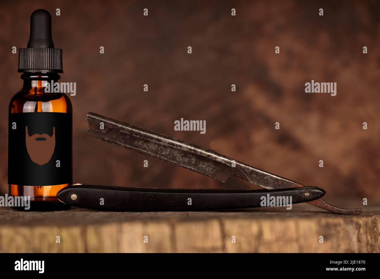 A bottle of beard oil, an old razor. Vintage style mockup oil beard ...
