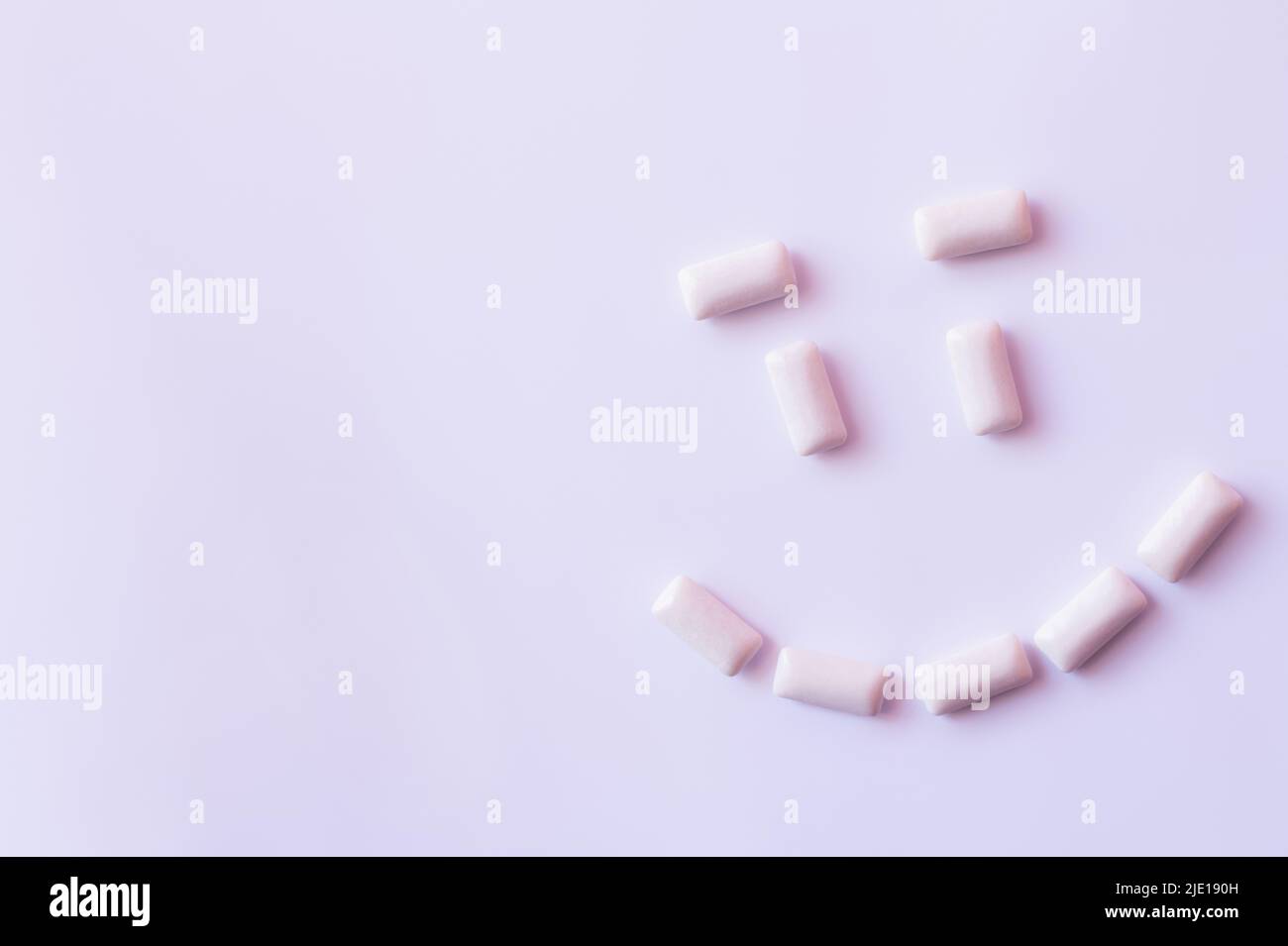 Flat lay with smile from chewing gums on white background Stock Photo ...