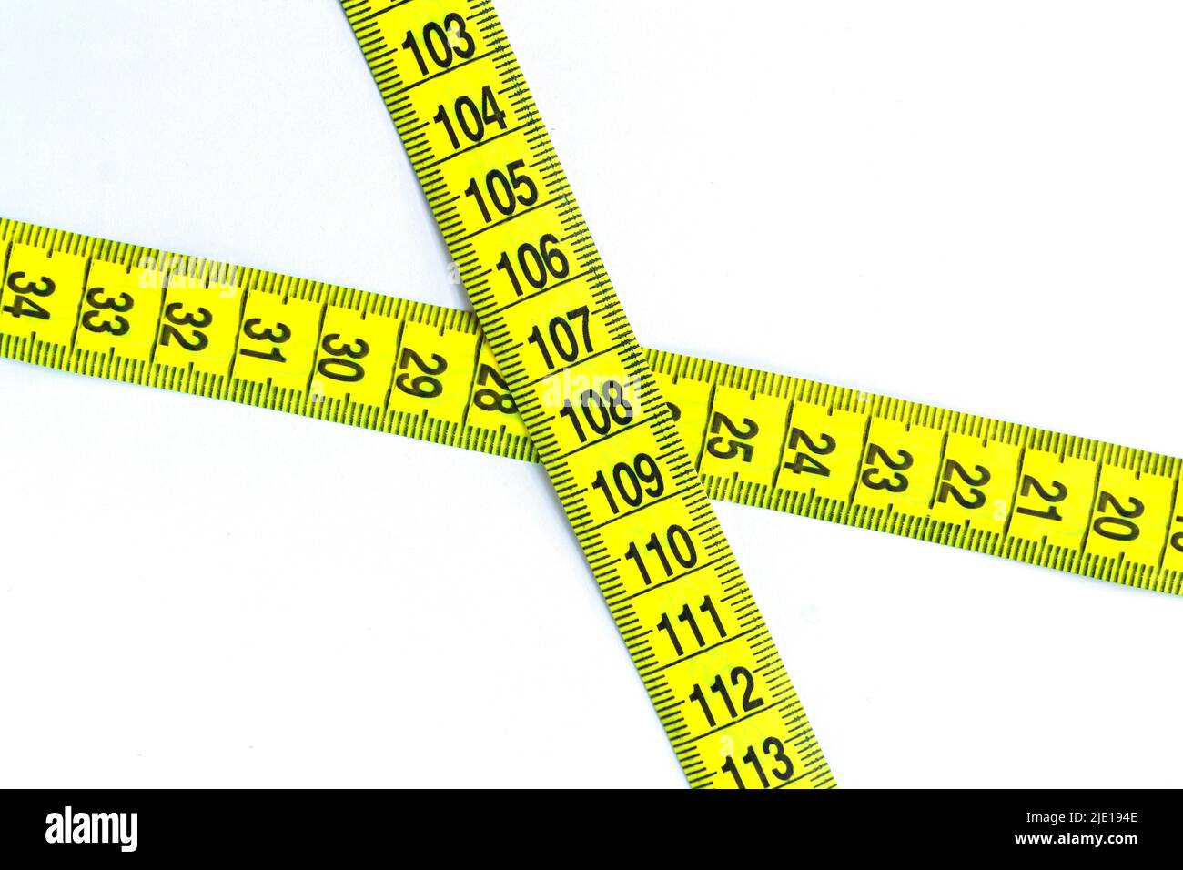 Yellow measuring or centimeter tape isolated on white background. Top ...