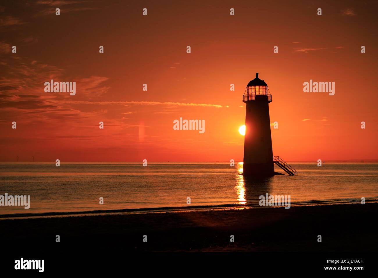 Sunrise over Talacre lighthouse on the North Wales coast Stock Photo ...