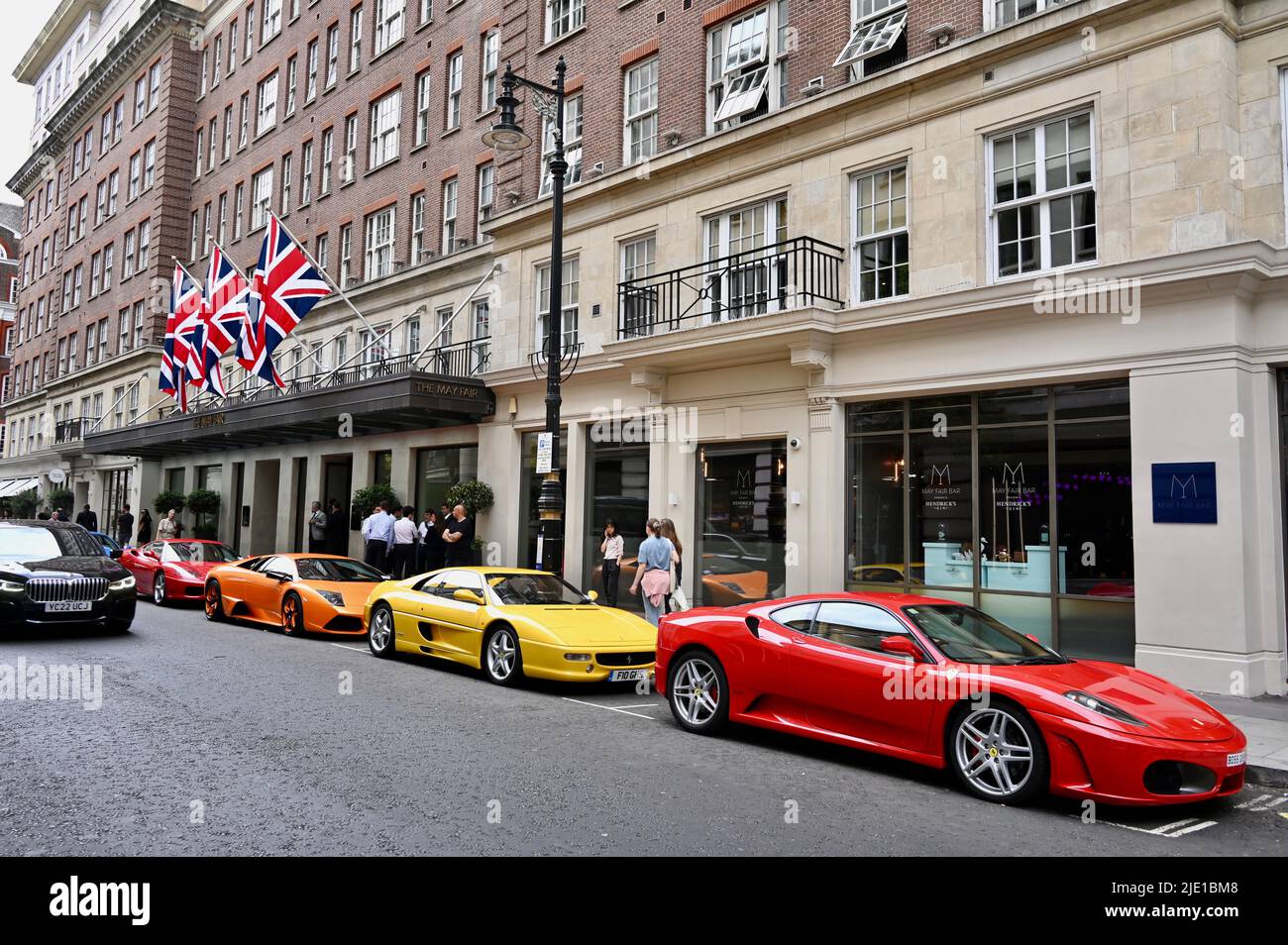 London, UK. 24th June 2022. A row of Ferraris and Lamborghinis parked ...