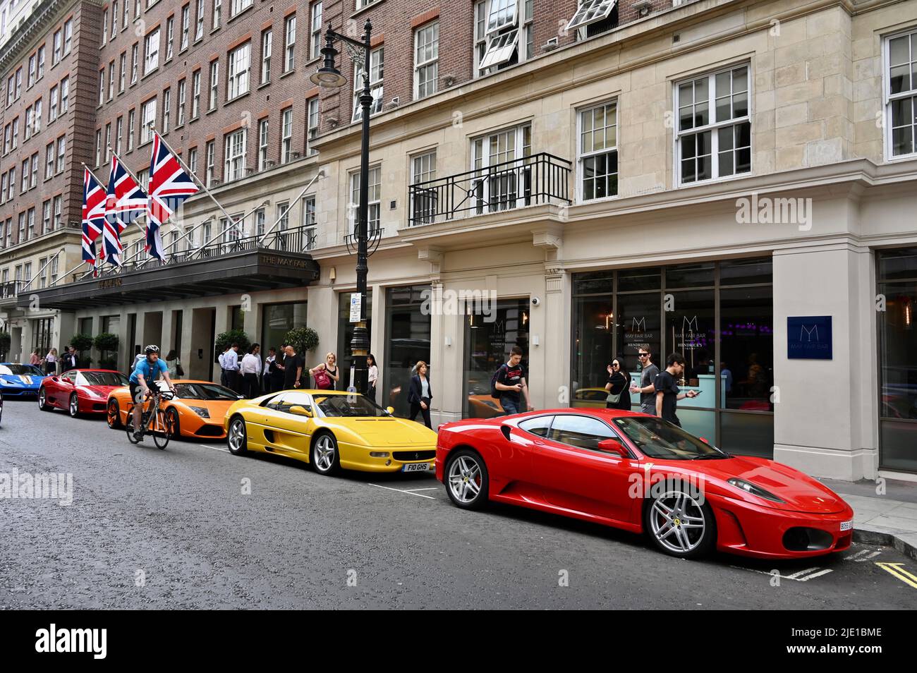 London, UK. 24th June 2022. A row of Ferraris and Lamborghinis parked ...