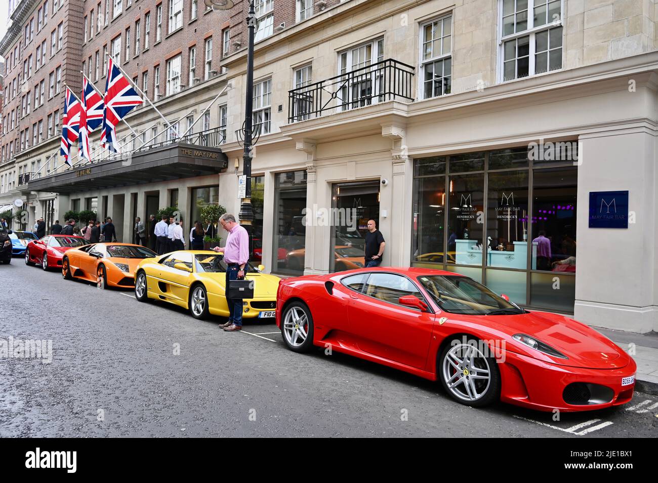 London, UK. 24th June 2022. A row of Ferraris and Lamborghinis parked ...