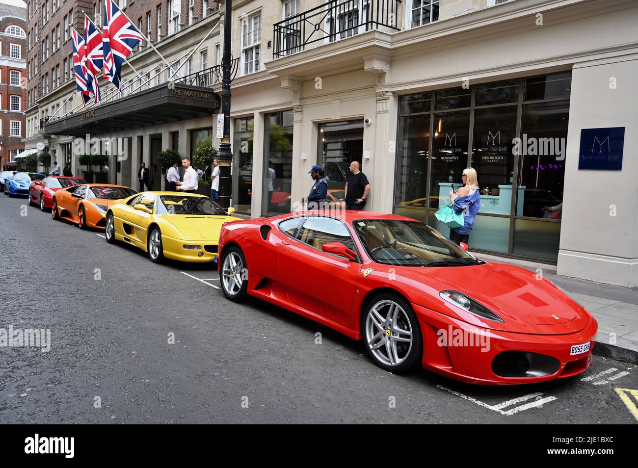 London, UK. 24th June 2022. A row of Ferraris and Lamborghinis parked ...