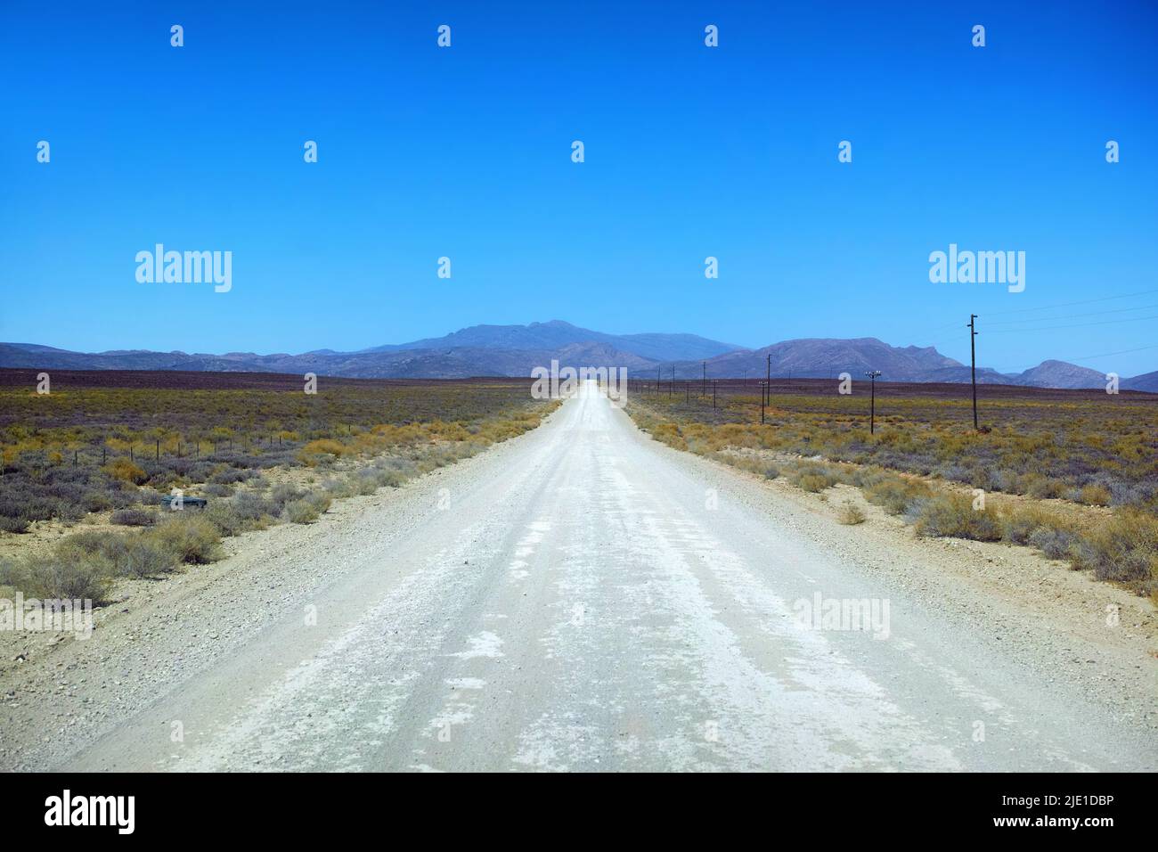 Dirt road in arid and barren highland in Savanna Desert in rural South ...
