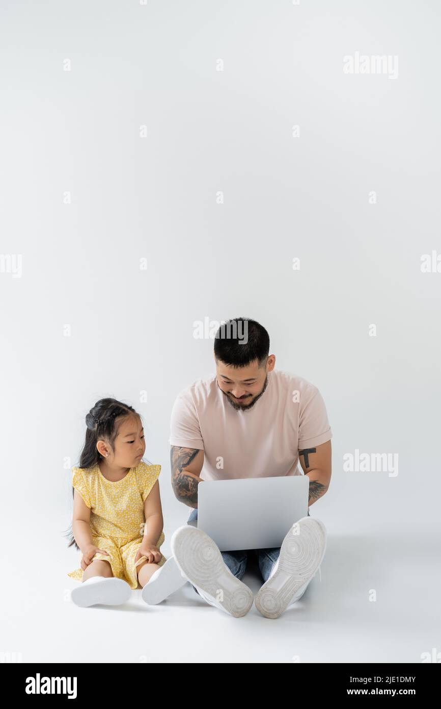 Father working remotely on laptop hi-res stock photography and images ...