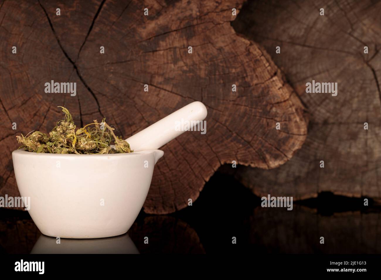 Medicinal marijuana extract, cbd. White mortar and dry cannabis ...