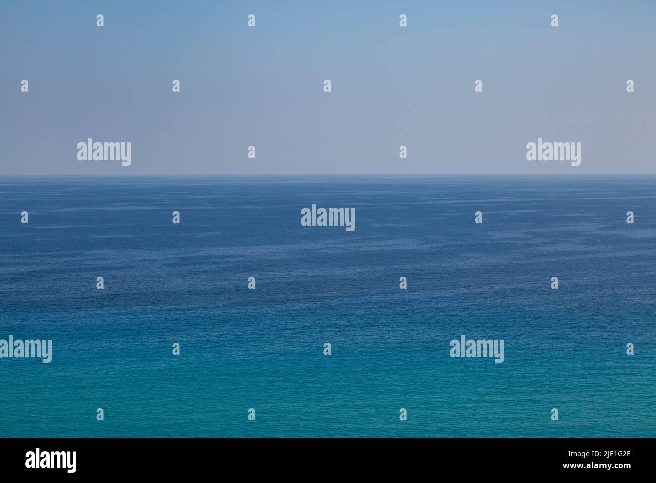 Looking out over the ocean with a blue sky overhead Stock Photo - Alamy