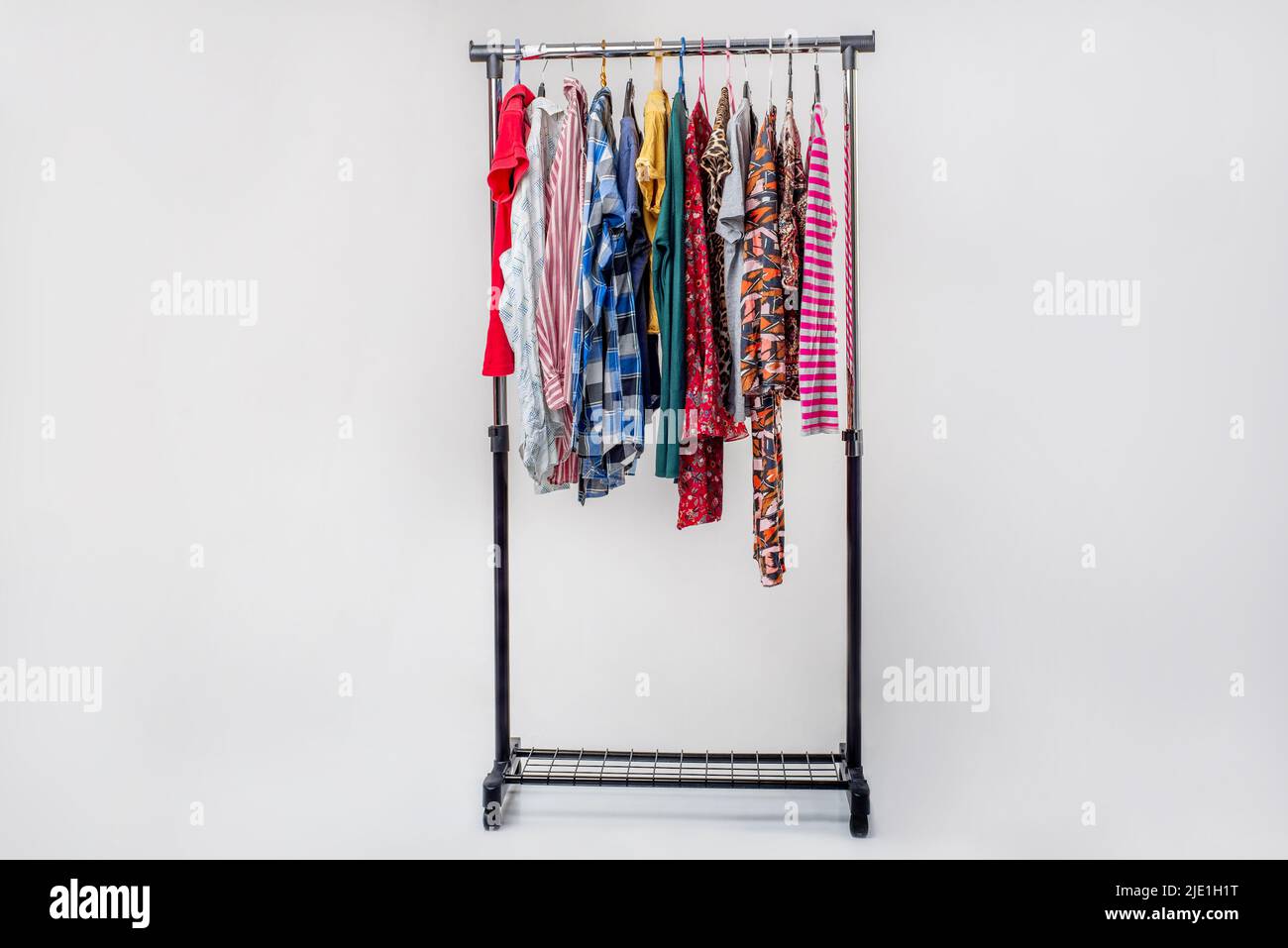 Various second-hand clothes from the wardrobe on the rack Stock Photo ...