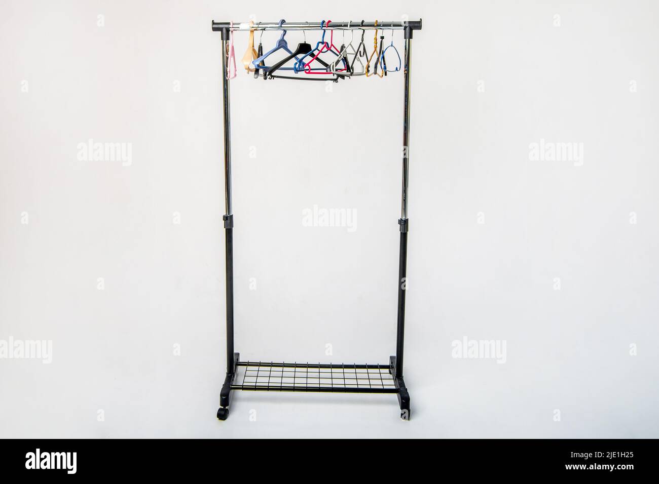 Empty hangers on an empty wardrobe rack. Minimalism and sustainable ...