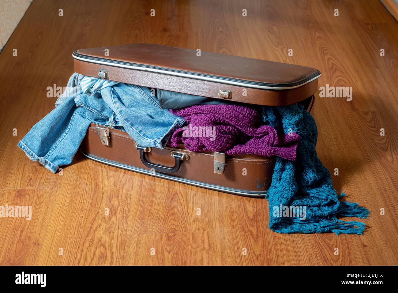 Wardrobe overflowing with clothes hi-res stock photography and images ...