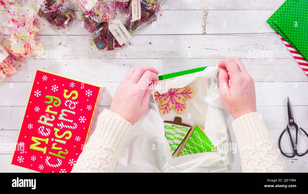 Flat lay. Step by step. Packaging homemade fudge and cookies into a ...