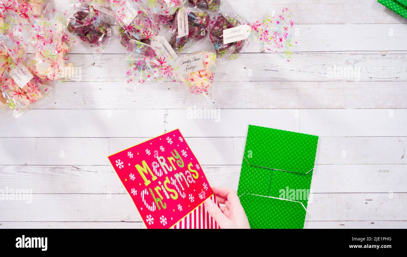 Flat lay. Step by step. Packaging homemade fudge and cookies into a ...