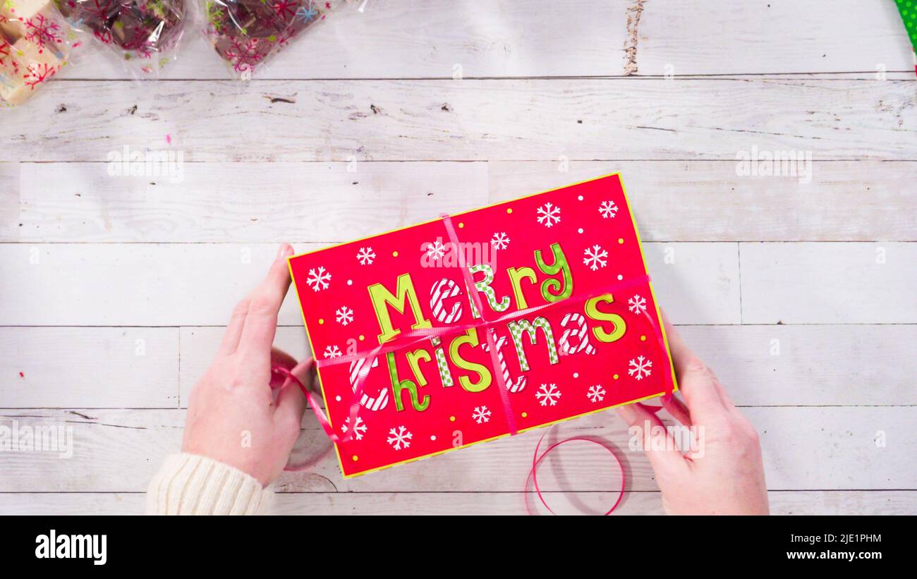 Flat lay. Step by step. Packaging homemade fudge and cookies into a ...