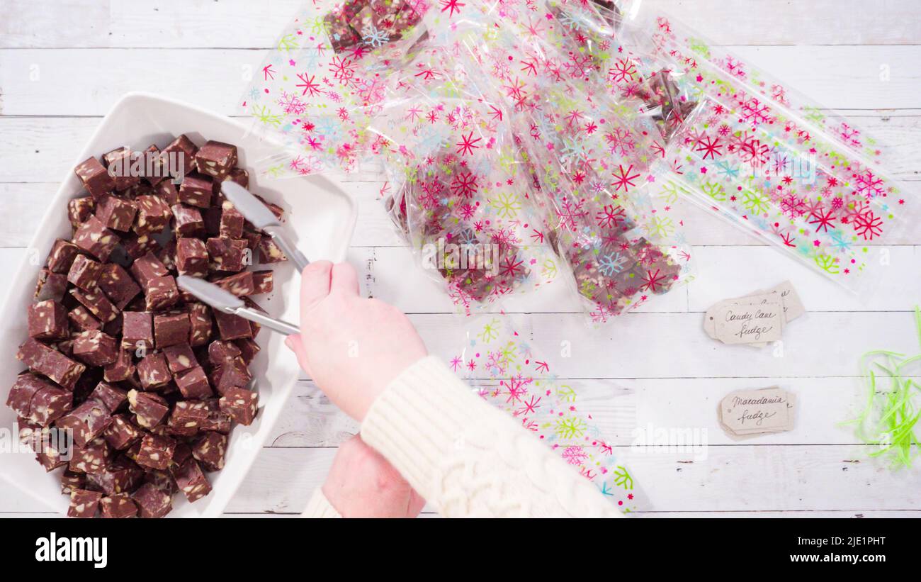 Flat lay. Step by step. Packaging homemade macadamia fudge into small ...