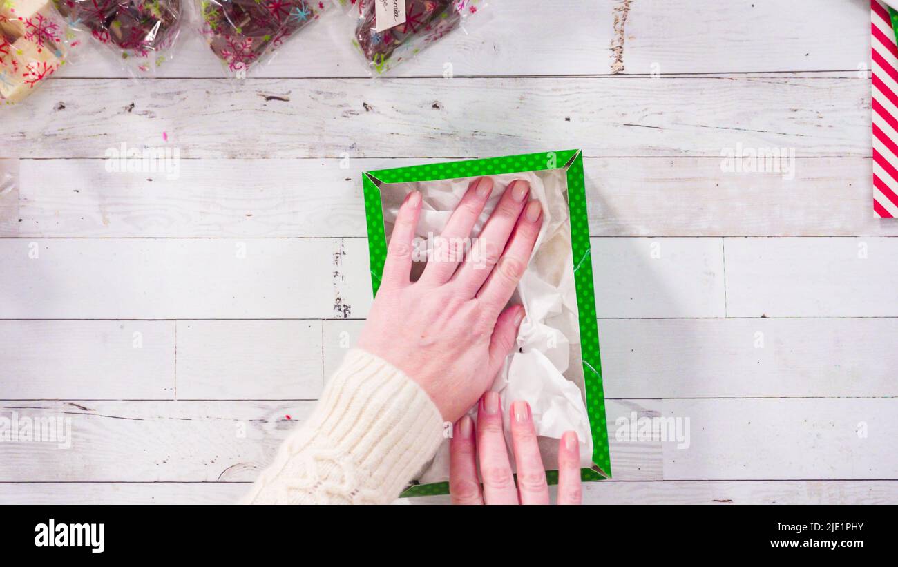 Flat lay. Step by step. Packaging homemade fudge and cookies into a ...