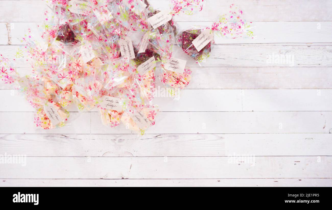 Flat lay. Step by step. Packaging homemade candy cane fudge into small ...