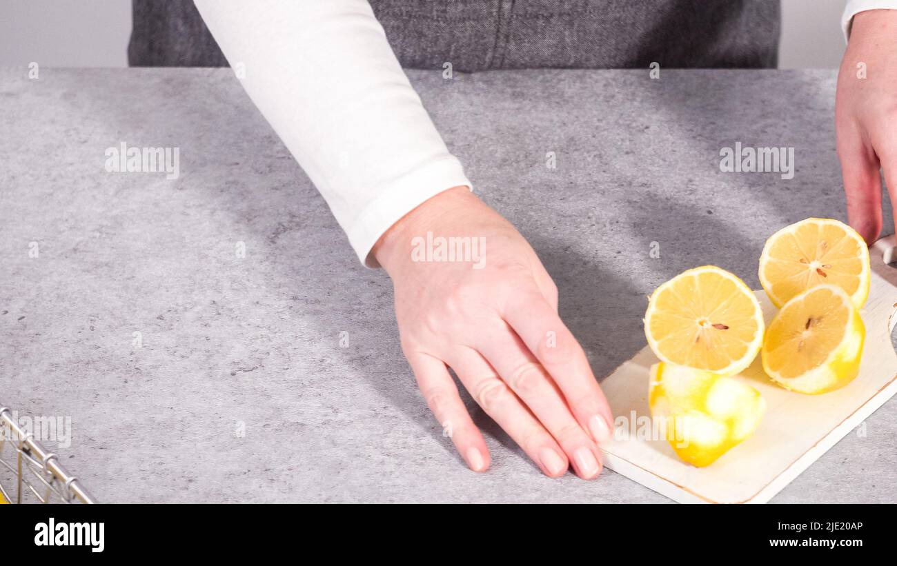 Step by step. Squeezing fresh lemons for baking lemon cranberry bundt ...