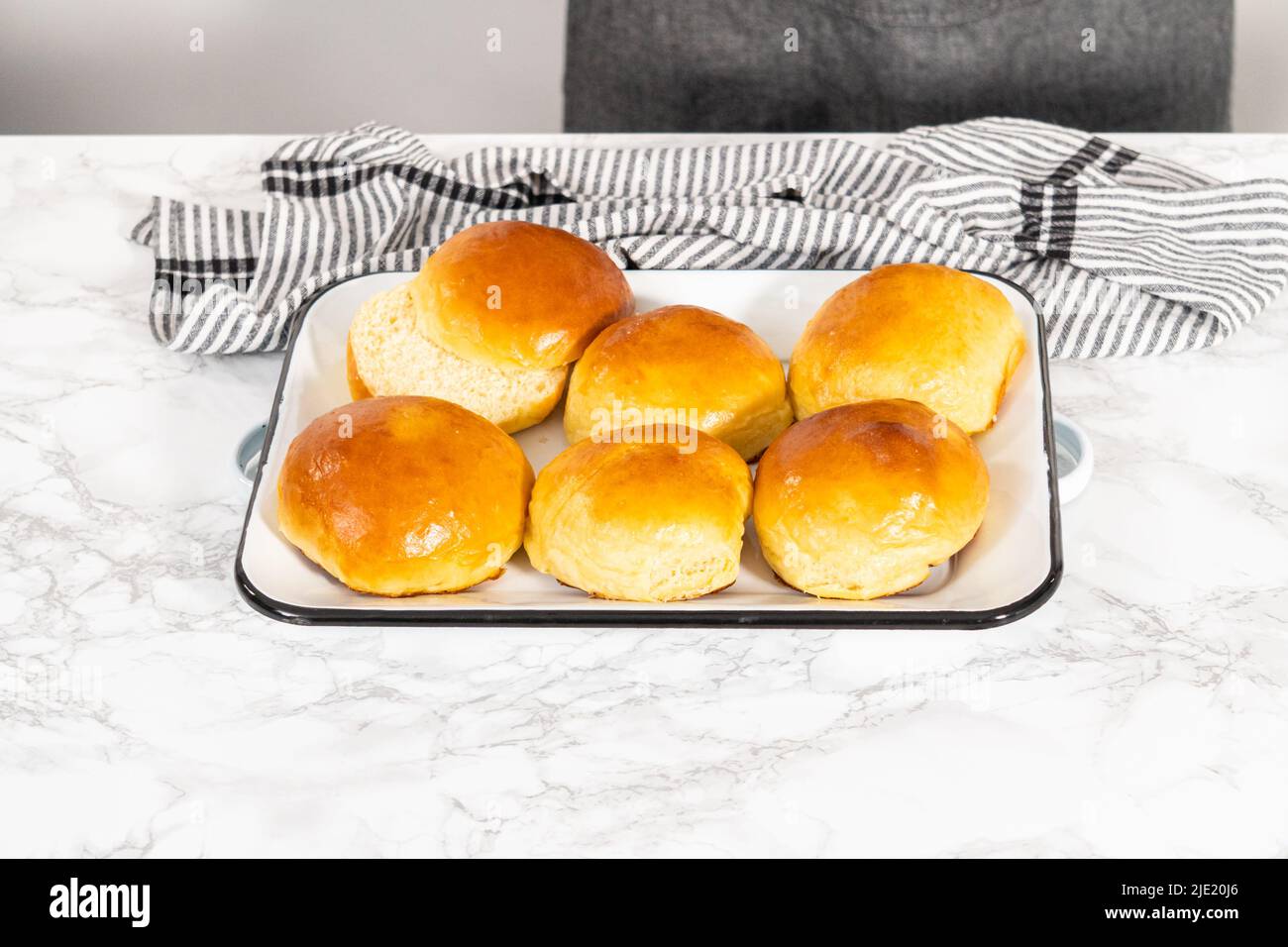 Freshly baked brioche buns on a metal serving tray Stock Photo - Alamy