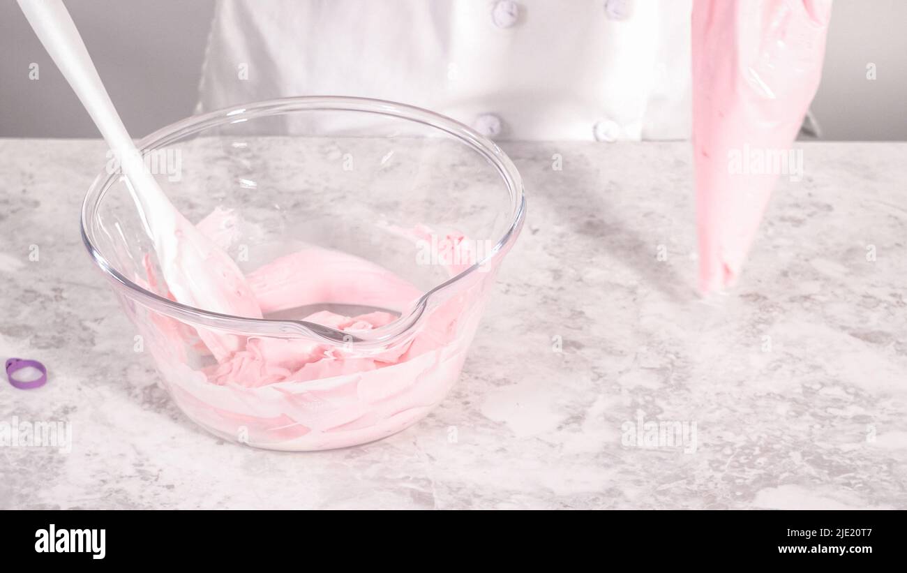 Step by step. Pink vanilla buttercream frosting in a piping bag Stock ...